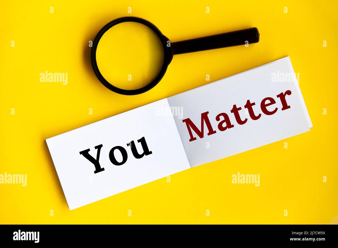 You matter text on notepad with magnifying glass on yellow cover ...