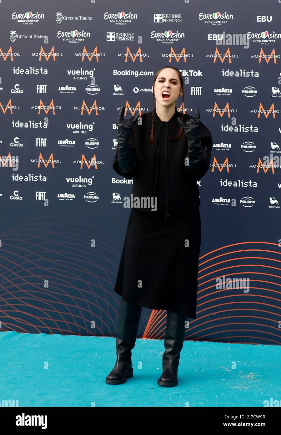 Contestant Andrea poses on the "Turquoise Carpet" during the opening ...
