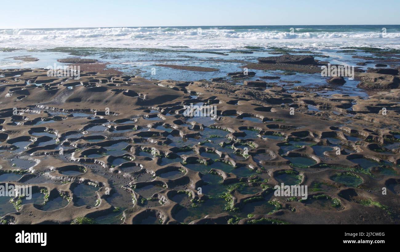 Eroded rock formation, tide pool in La Jolla, California coast, USA ...