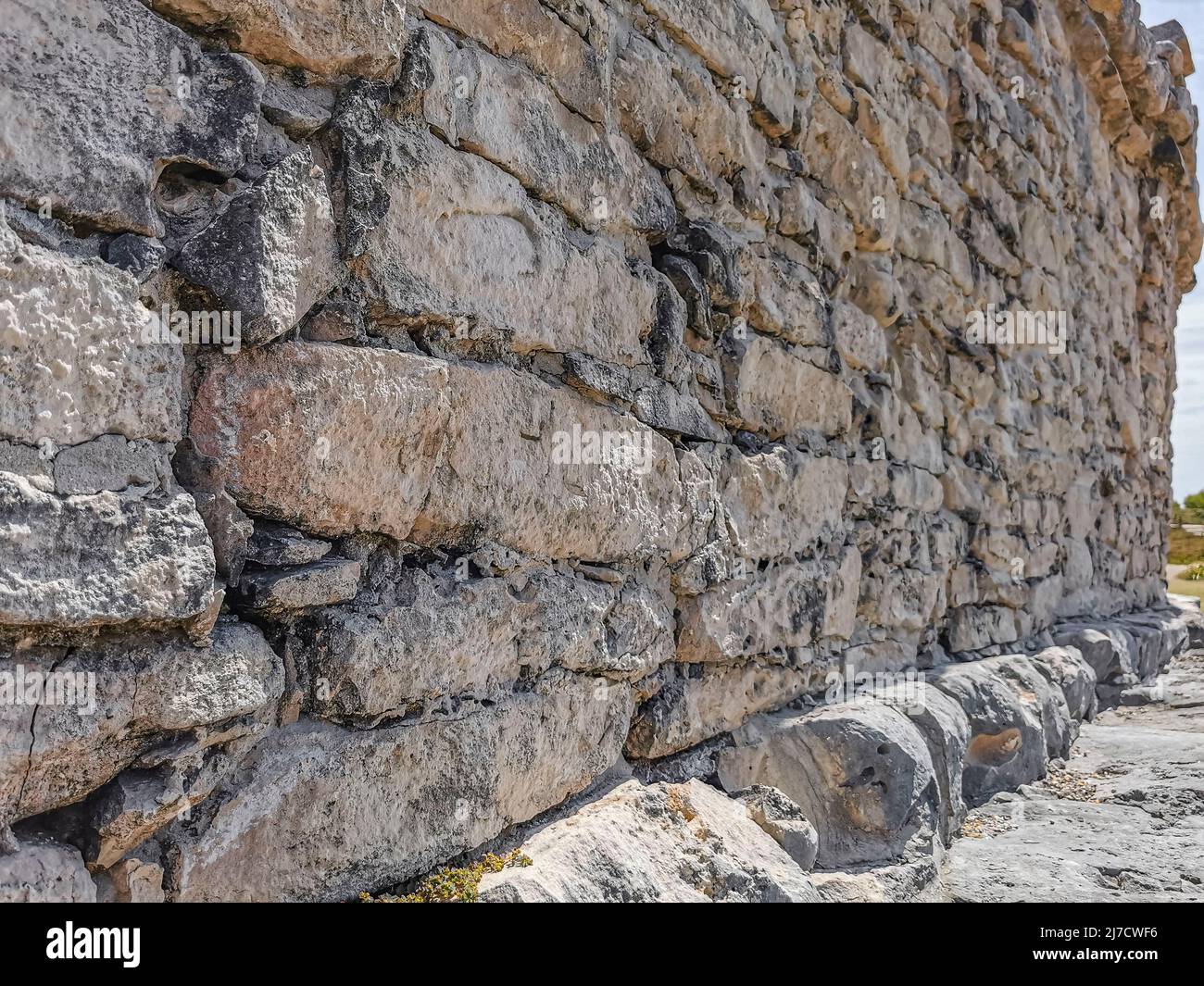 Ancient Tulum ruins Mayan site with temple ruins pyramids and artifacts in the tropical natural ...