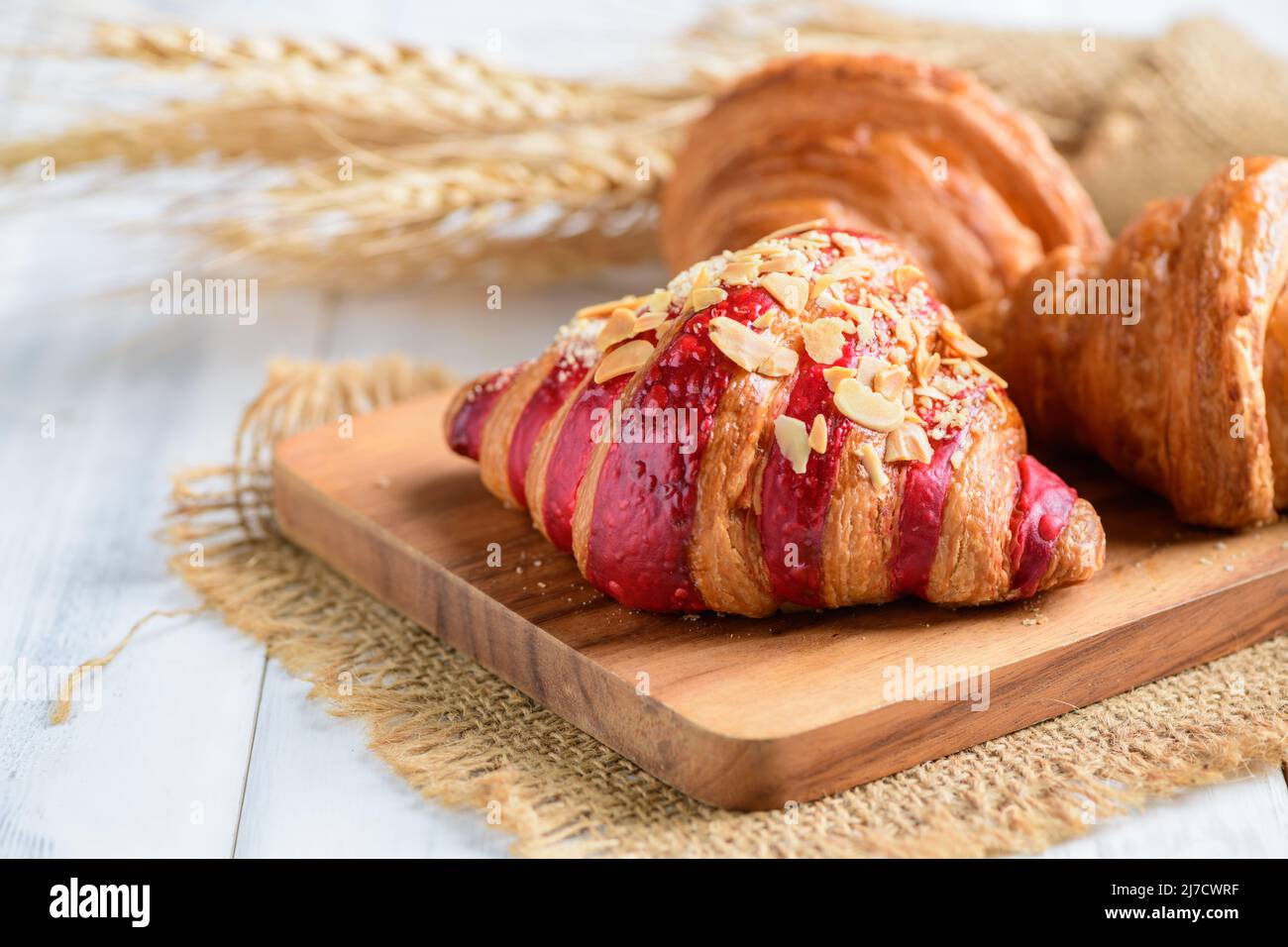 Raspberry Crumble Cream Cheese Croissant on wood plate, Home made ...
