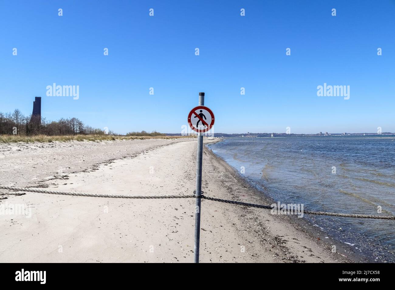 An area cordoned off with ropes and stakes on the beach of the Baltic ...