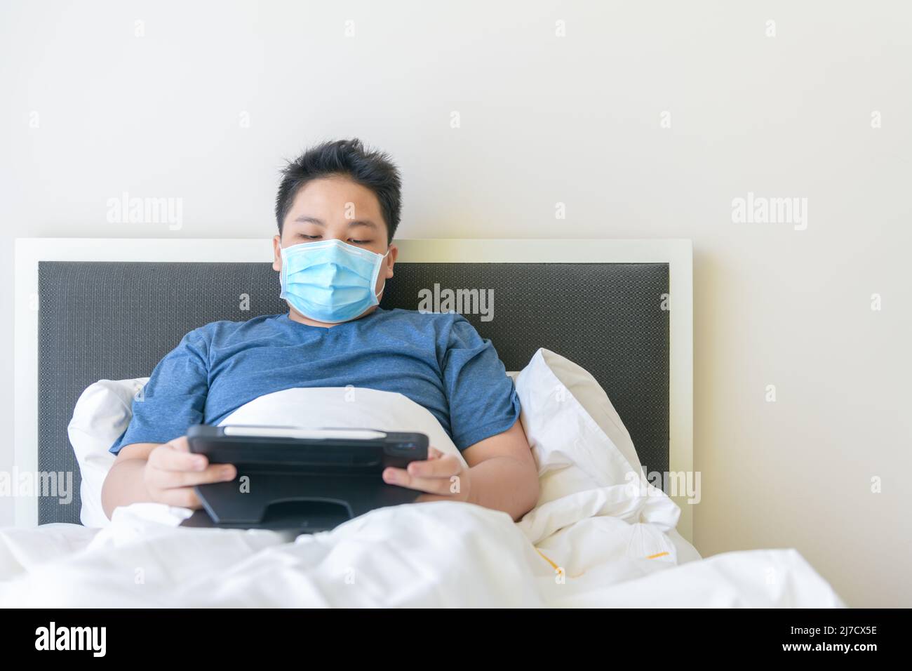 School boy in bed ill hi-res stock photography and images - Alamy