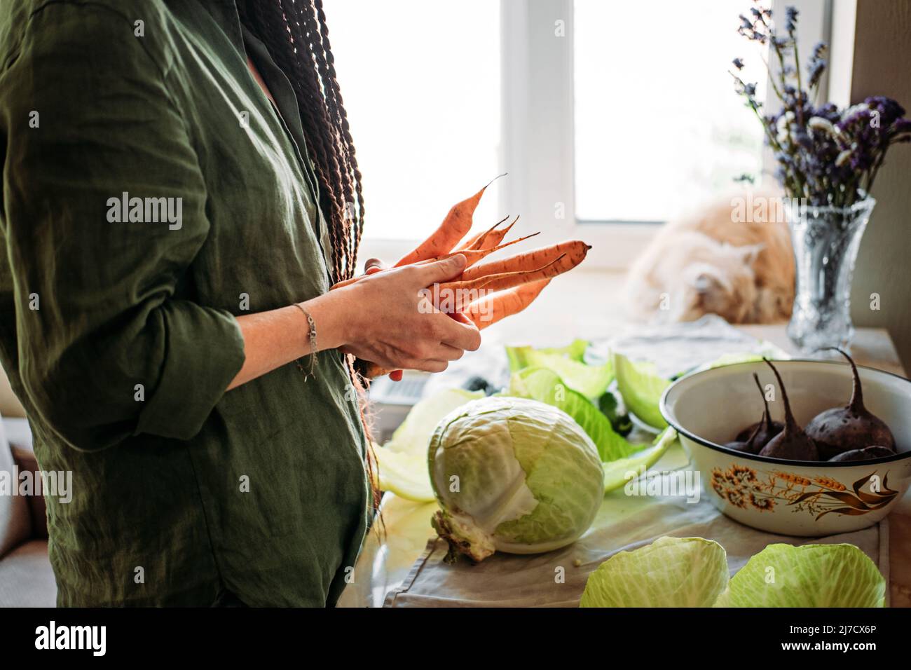 Faceless portrait of vegan woman holding vegetables. Veganism ...