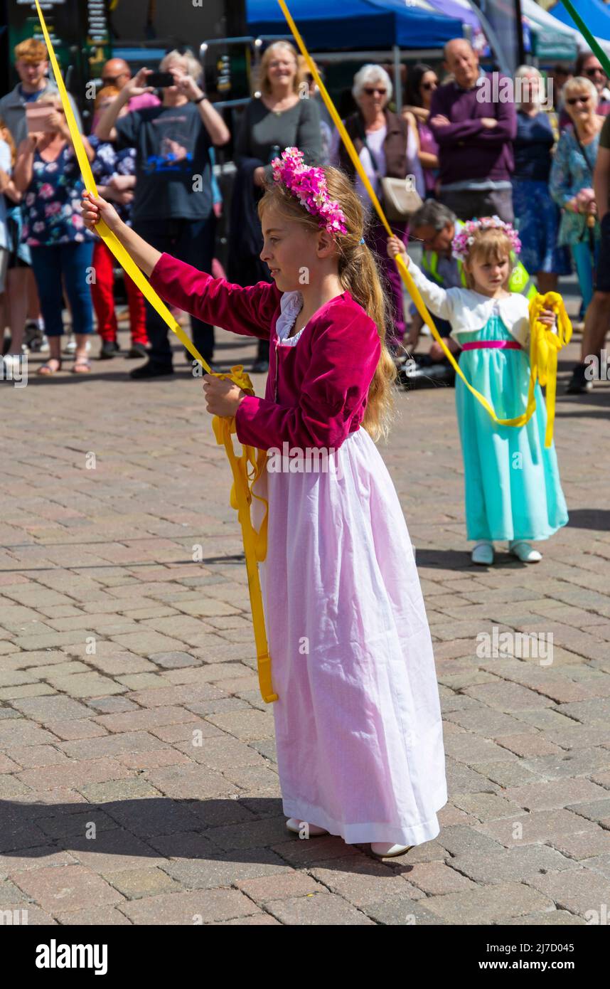 Children in costumes dancing around maypole hi-res stock photography ...