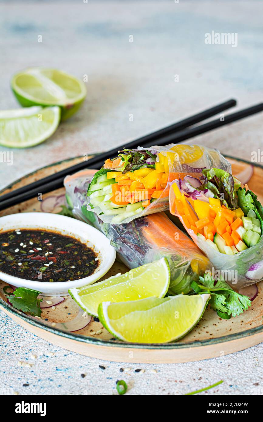 Fresh Asian appetizer Spring rolls (Nem) made from rice paper and raw ...