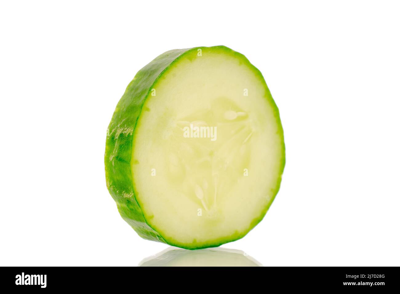 One slice of juicy smooth cucumber, macro, isolated on white background ...