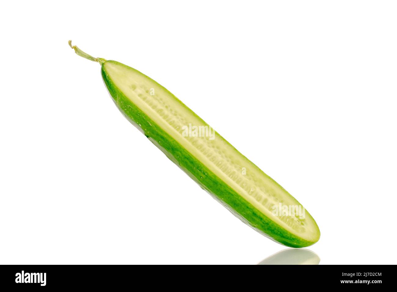 One half of a juicy smooth cucumber, macro, isolated on a white ...