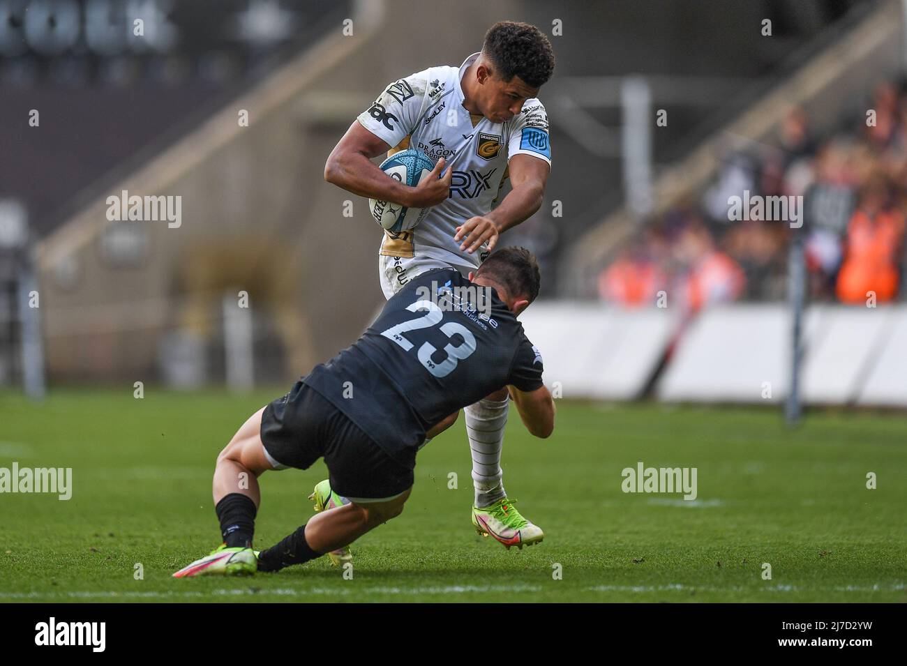 Luke Morgan of Ospreys, tackles Rio Dyer of Dragons Stock Photo - Alamy
