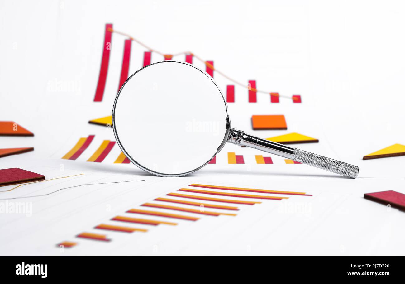 Market fall, economic crisis analysis. Magnifying glass and charts ...