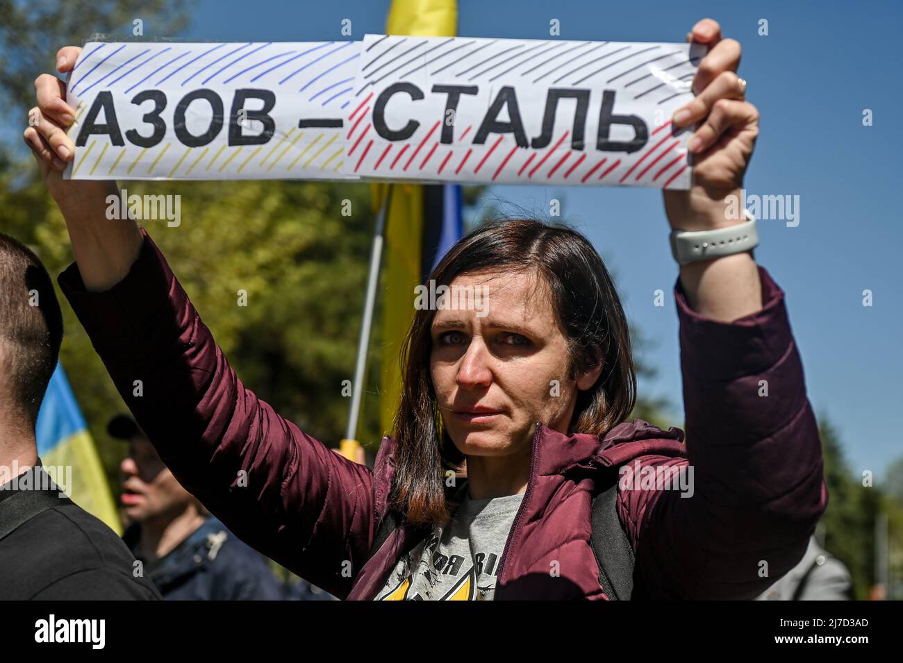 ZAPORIZHZHIA, UKRAINE - MAY 7, 2022 - A woman holds a placard reading ...
