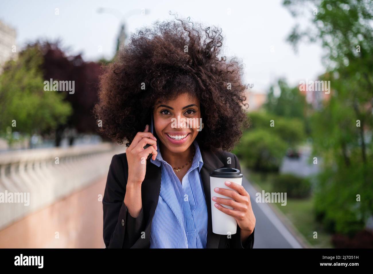 portrait young woman with afro type hair lifestyle Stock Photo - Alamy
