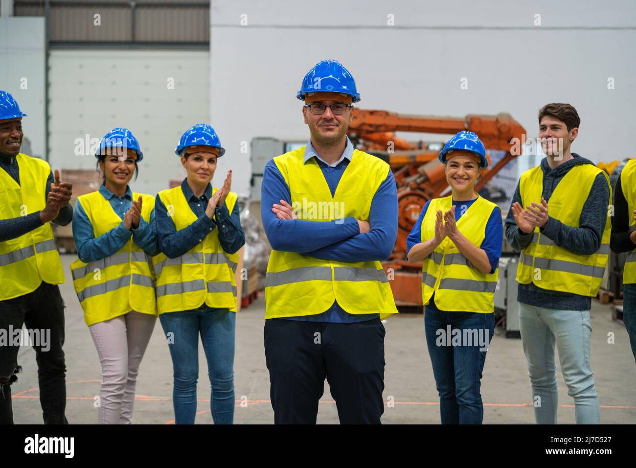 Engineers applauding the section chief for his promotion Stock Photo ...
