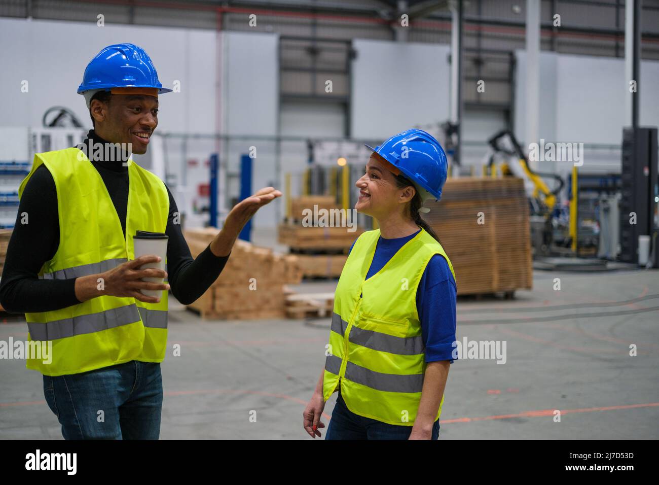 Two fellow engineers of different ages talking about work Stock Photo ...