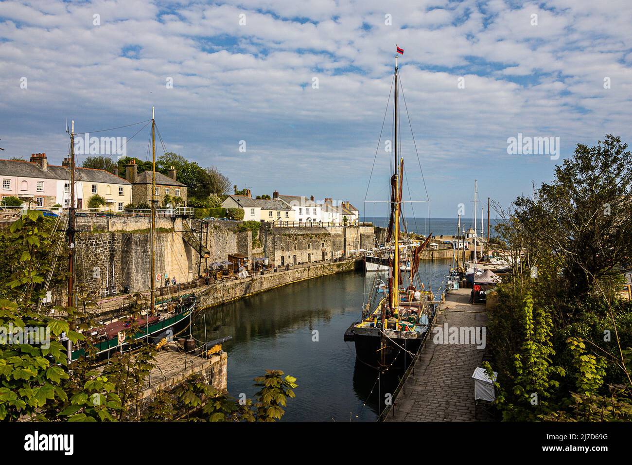 tall ship in the harbour of the village Charlestown, Cornwall, England ...