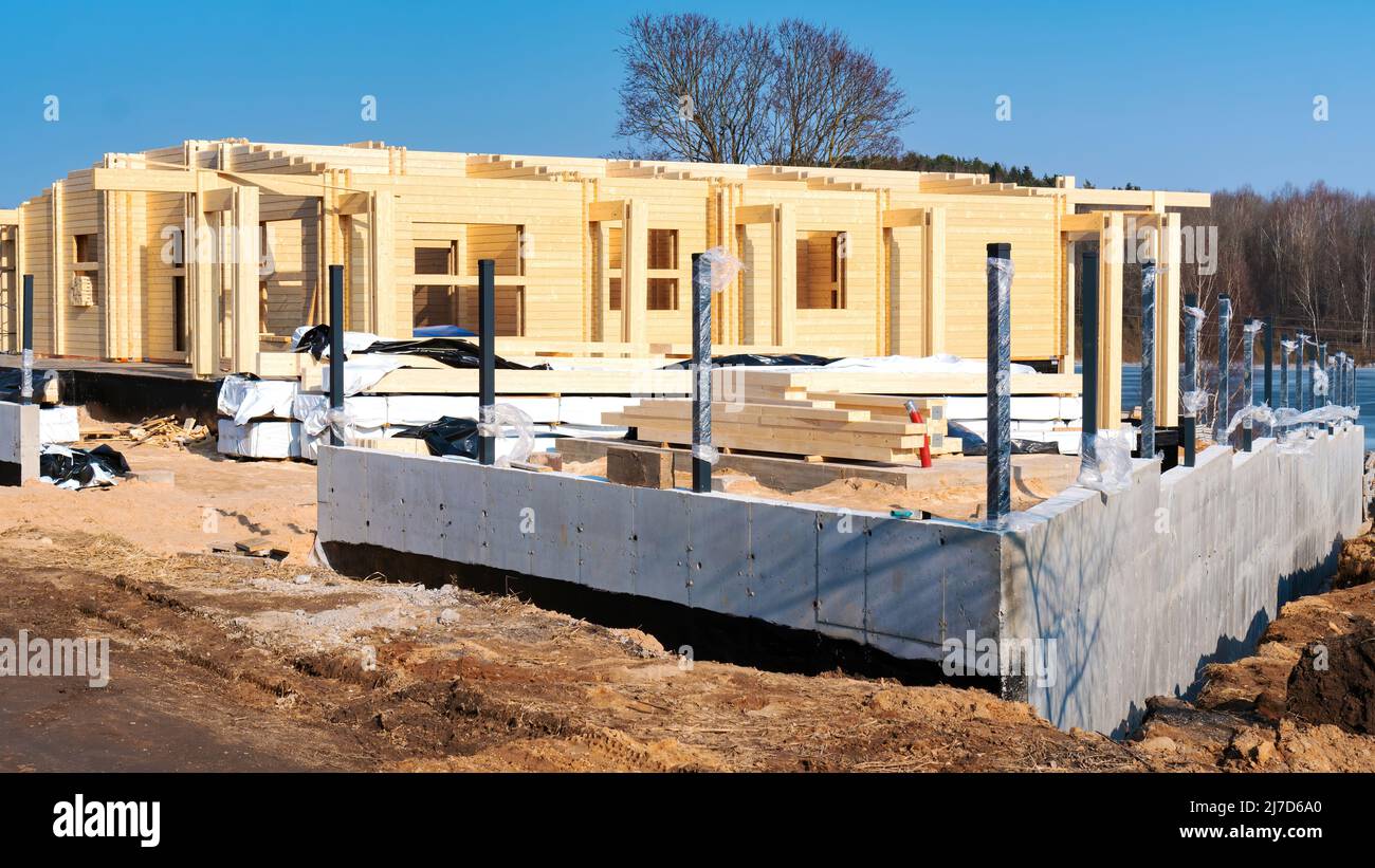 Concrete fence base for a modern country house. Construction of a fence ...