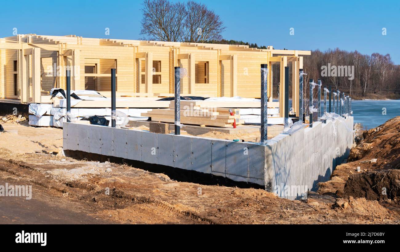 Construction of a fence with a concrete base or foundations covered ...