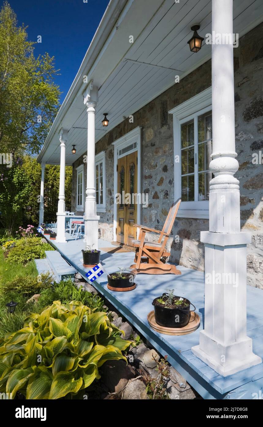 Old 1746 Canadiana cottage style fieldstone home facade with white and ...