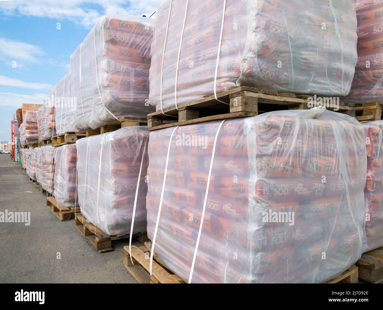 Voronezh, Russia - July 11, 2021: Cement pallets stand in an open-air ...