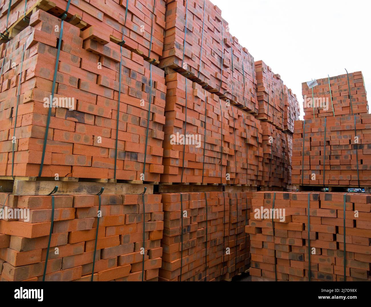 Pallets with red bricks are stored in an open area Stock Photo - Alamy