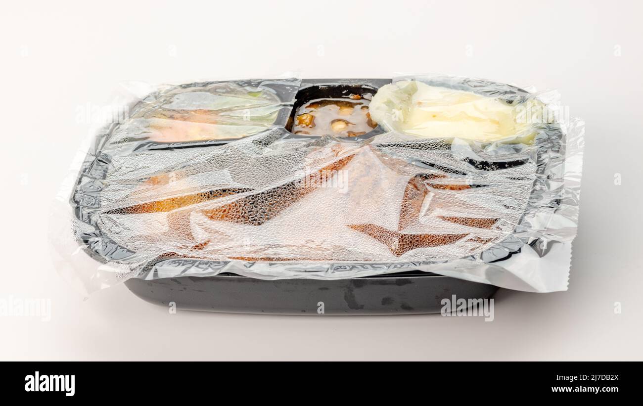 Plastic tray microwaveable TV dinner with a cover on Stock Photo - Alamy