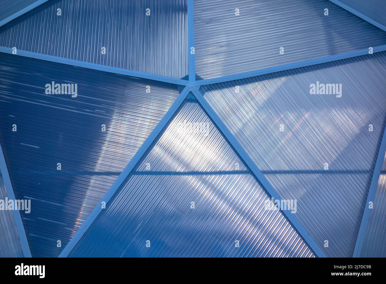 Polycarbonate panels on a Geodesic gardening dome that serves as a ...