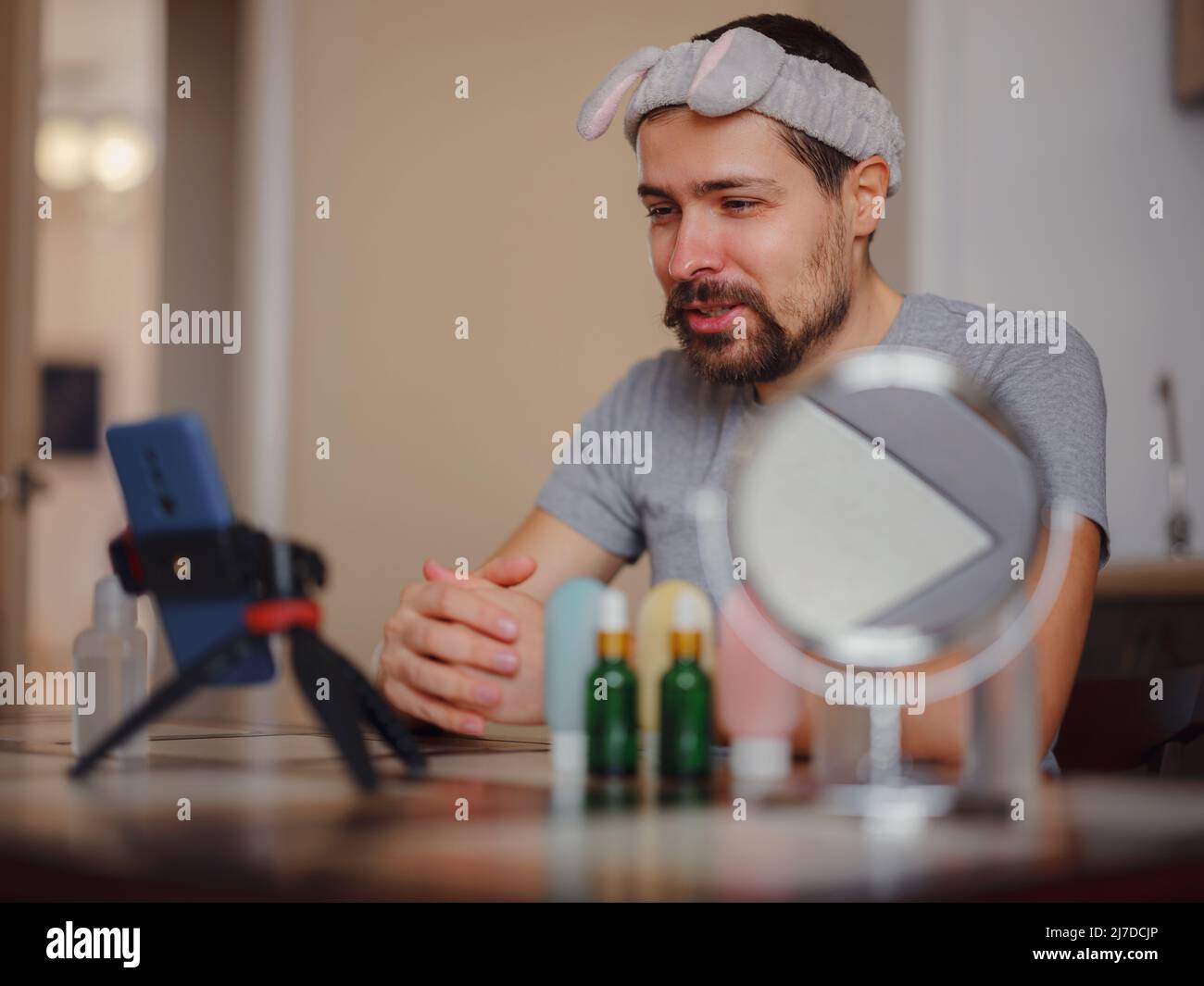 Men's beauty concept. caucAsian guy checking his skin. Beauty blogger. Male social media ...