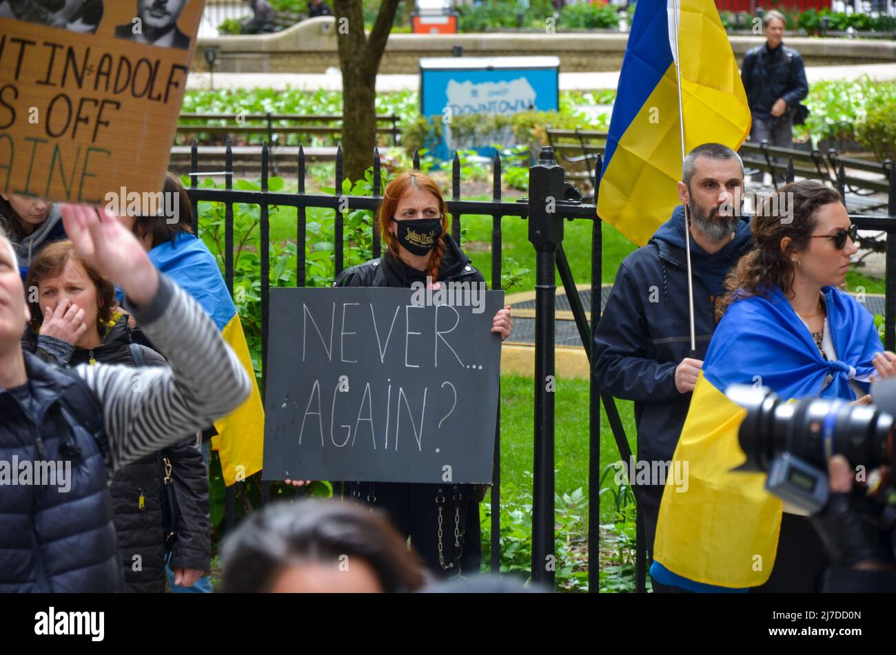 A participant holds a pro Ukraine sign to show support for Ukraine at ...