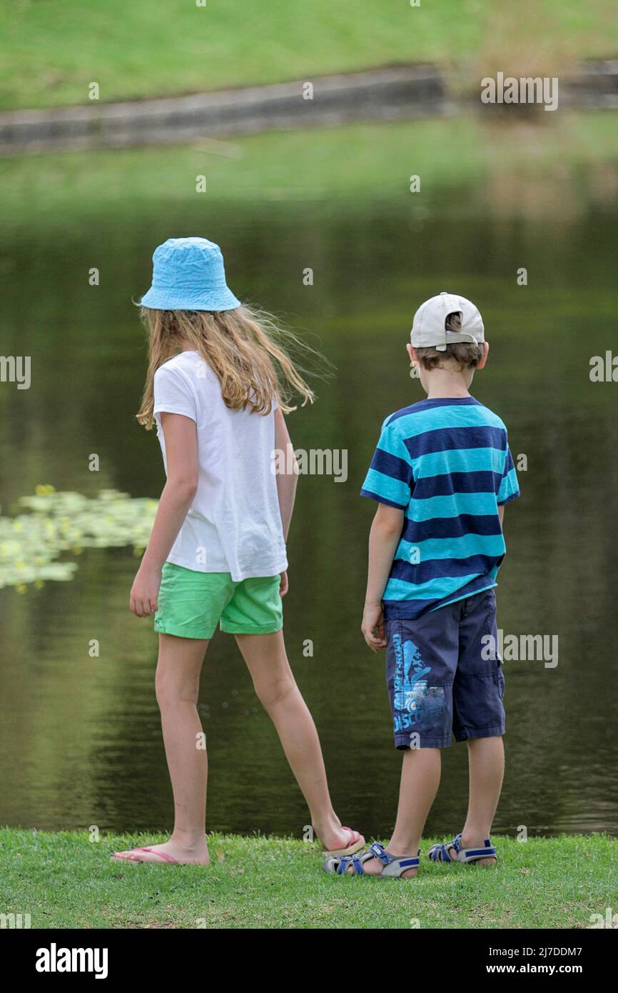 Sibling Serenity: Two Young Kids Admiring the Pond at Kirstenbosch ...