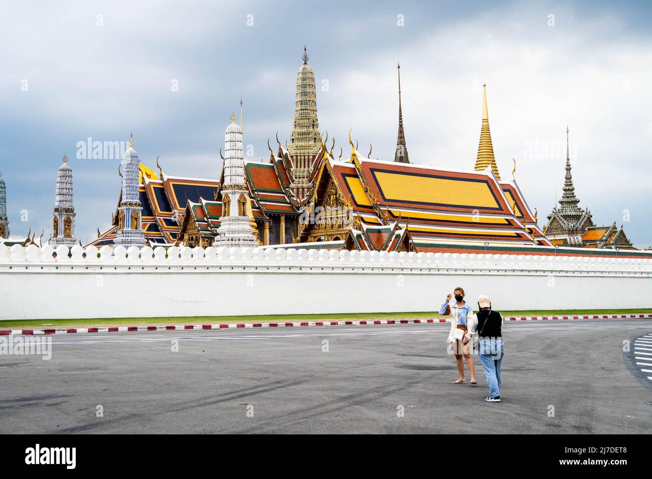People take photos in front of the Grand Palace. Thailand re-opens to ...