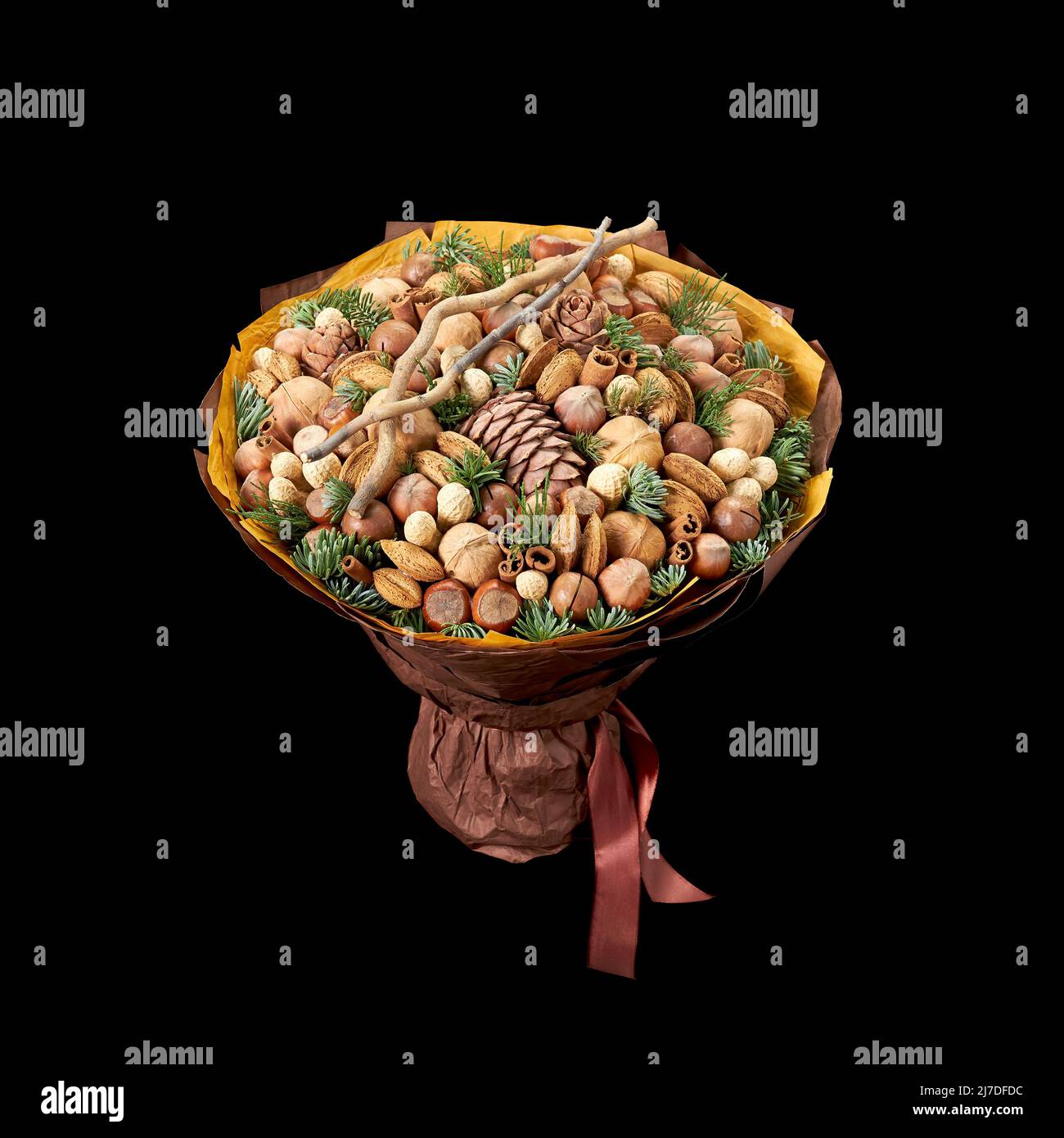 Large bouquet of nuts of different kinds, decorated with twigs of fir ...