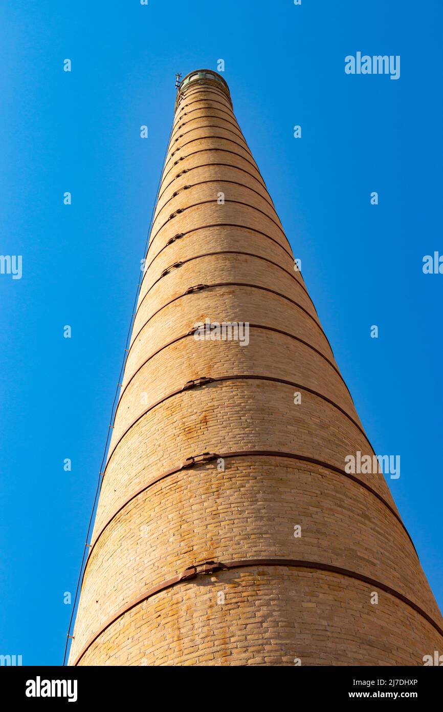 tall brick chimney against blue sky Andaluz contemporary art museum in ...
