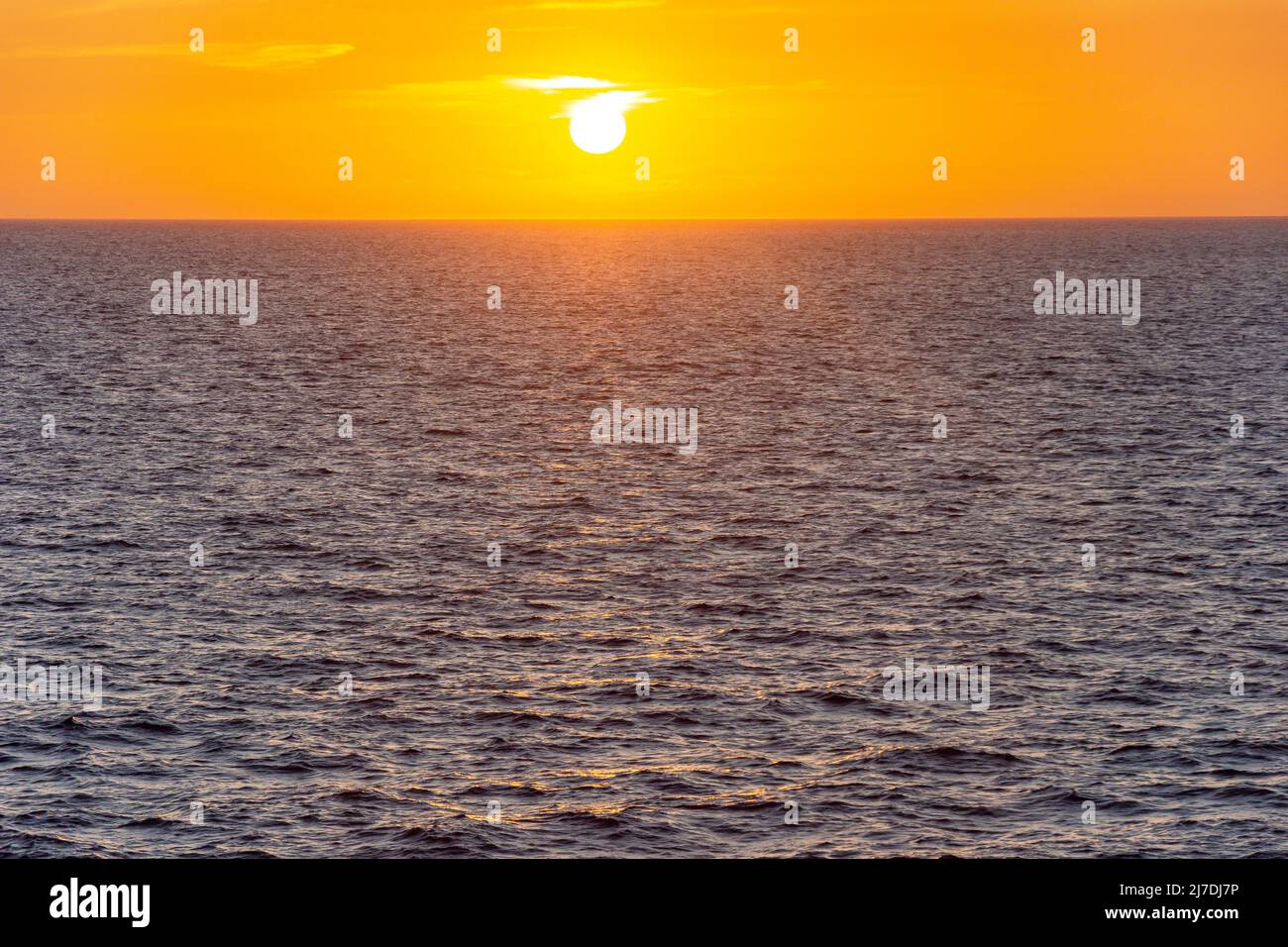 View of sun setting over sea from deck of Marella Explorer II cruise ...
