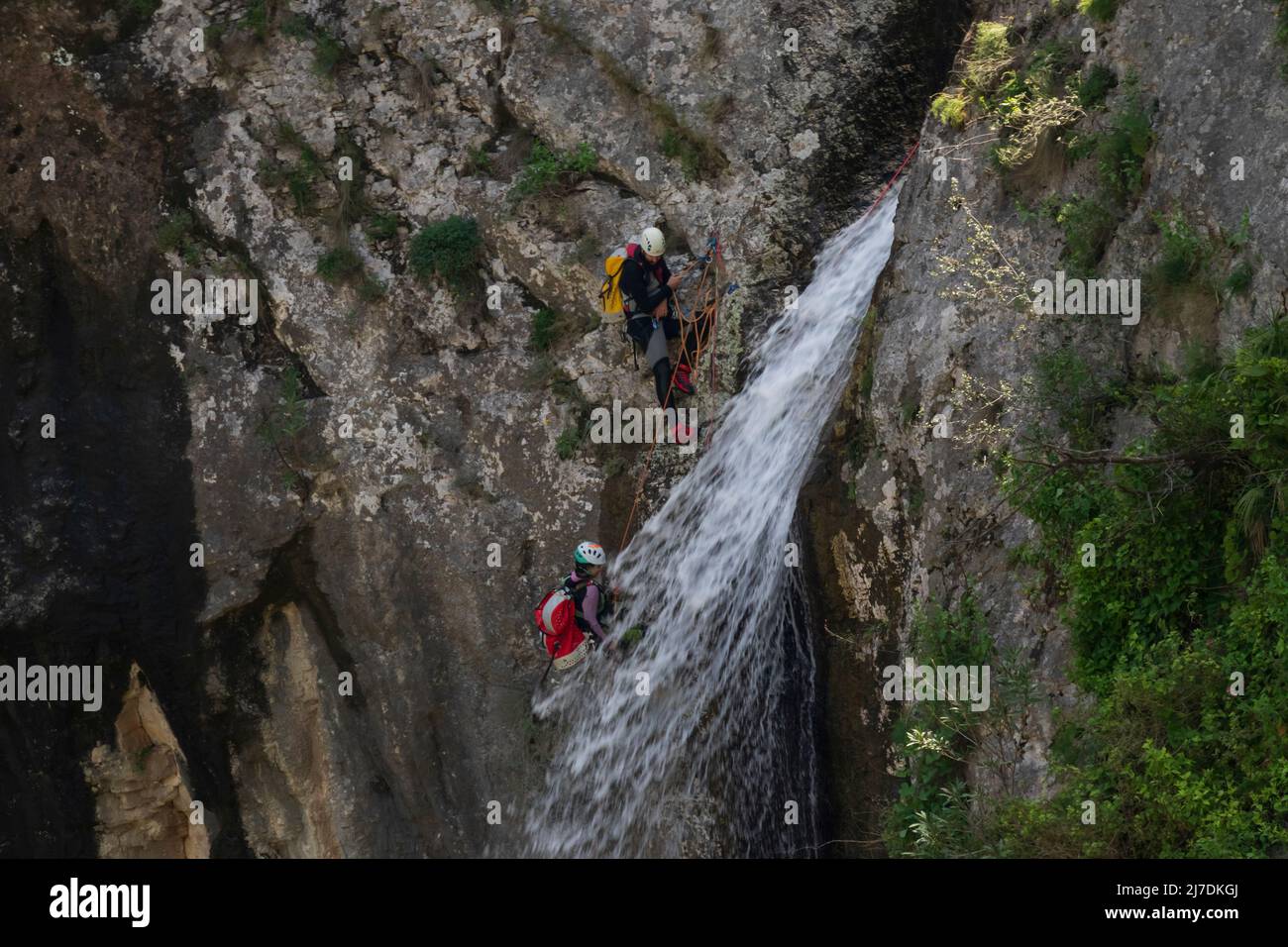 two people waterfall rappelling on canyoning adventure Stock Photo - Alamy