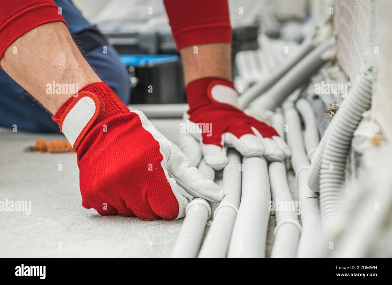 Professional Electrician Providing Plastic Electric Line Conduits Along ...