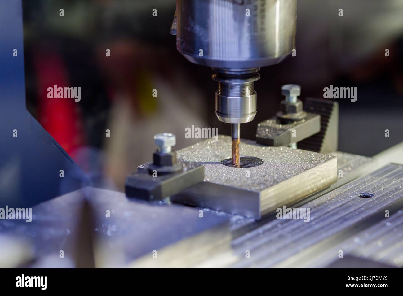 Automated cnc turning milling machine cutting metal workpiece - close ...