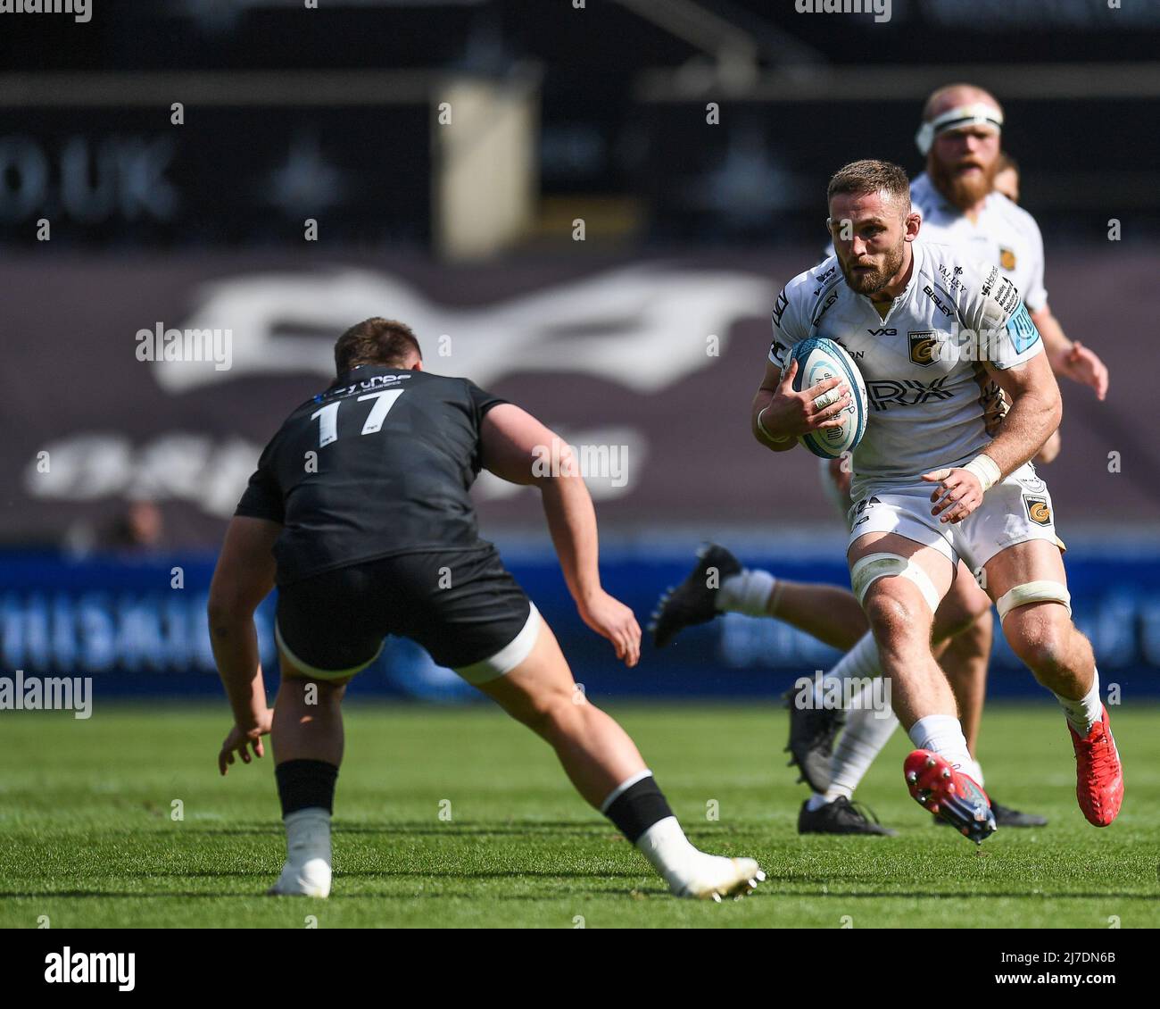 Harri Keddie of Dragons,, takes on Gareth Thomas of Ospreys Stock Photo ...