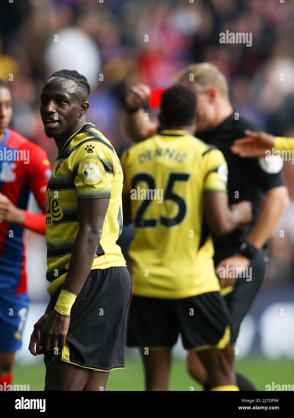 London, England, 7 May 2022. Hassane Kamara of Watford receives a red ...