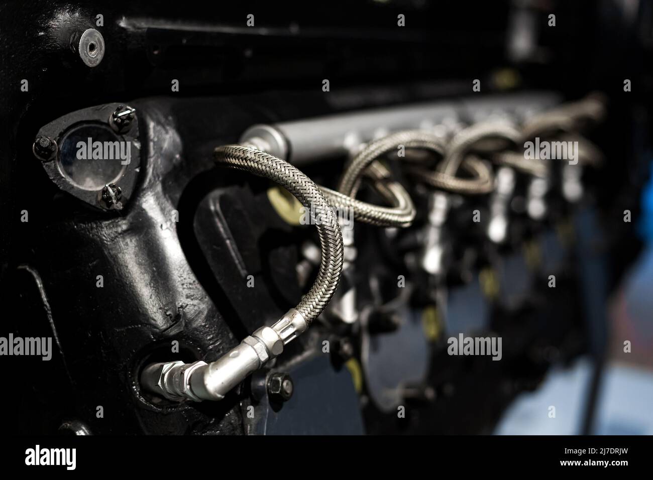 Close-up of a detail of a rare car engine. Metal mechanisms. Automotive ...