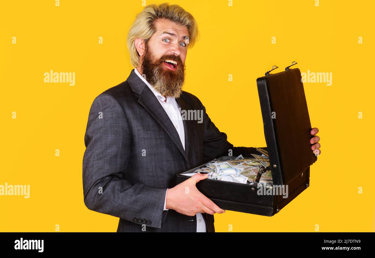 Happy businessman with briefcase full of money for business. Dollar ...