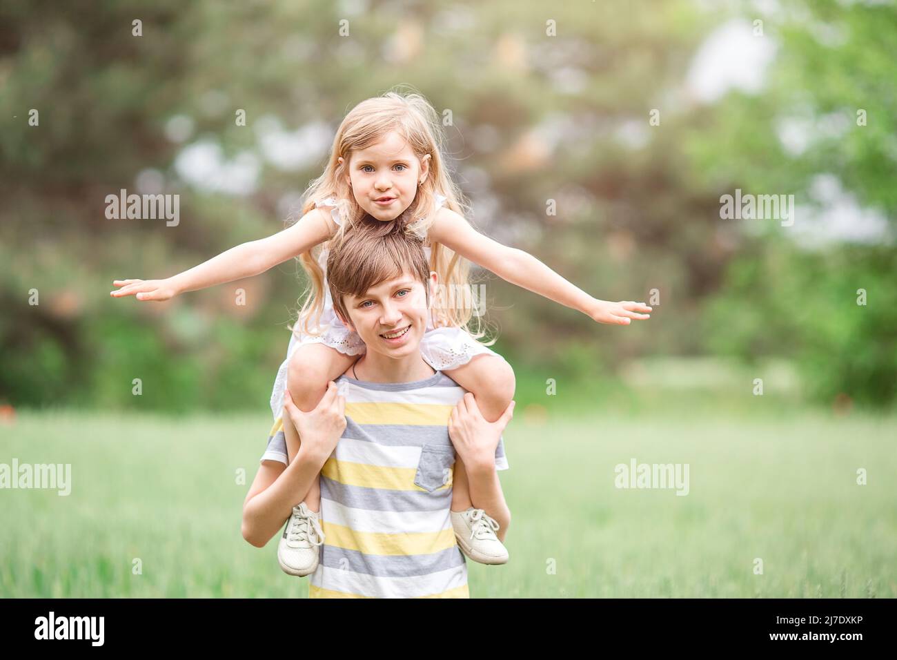 Little Boy And Girl Playing Outside