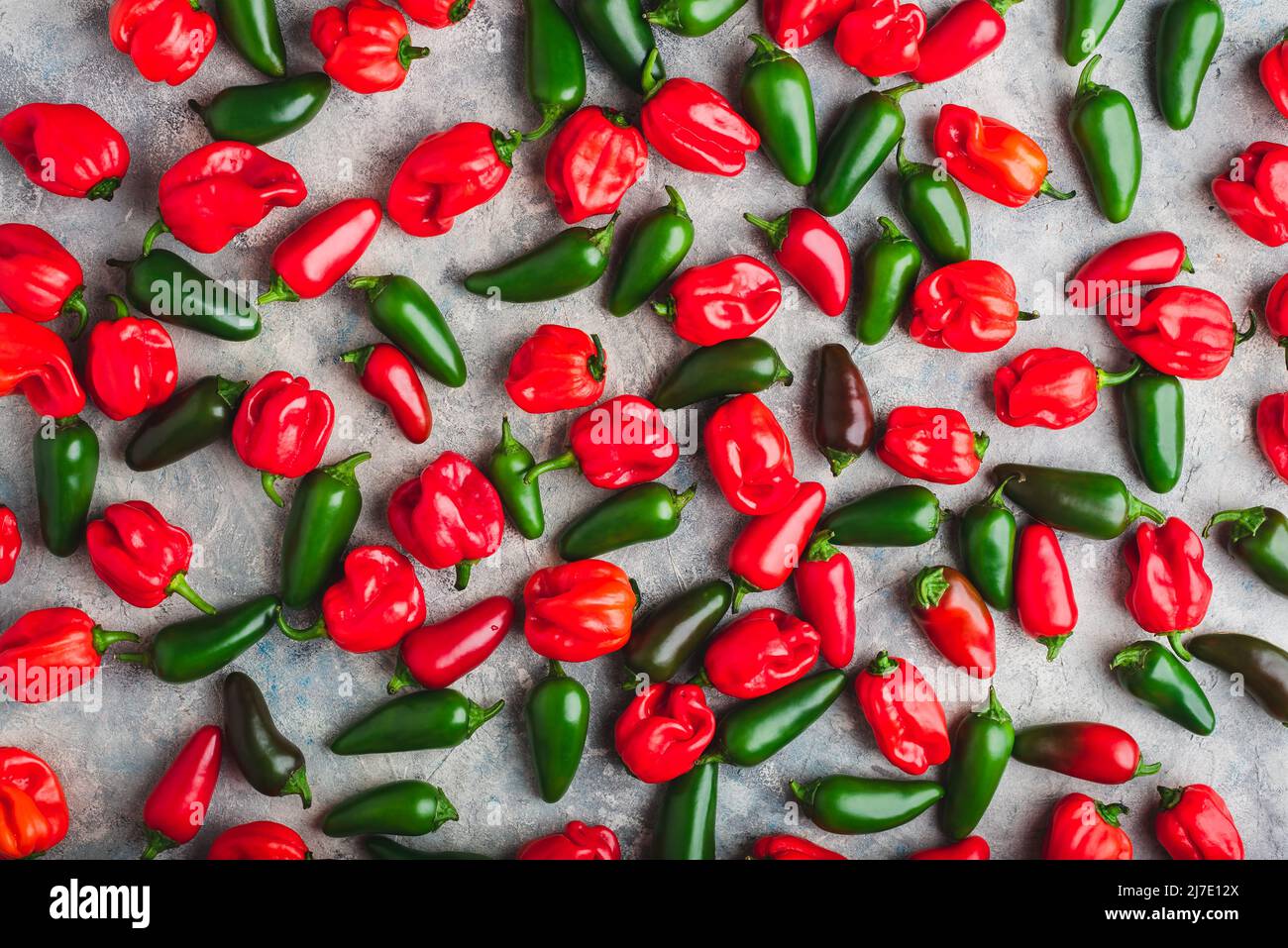Different Hot Chili Peppers on Light Gray Concrete Background Stock ...
