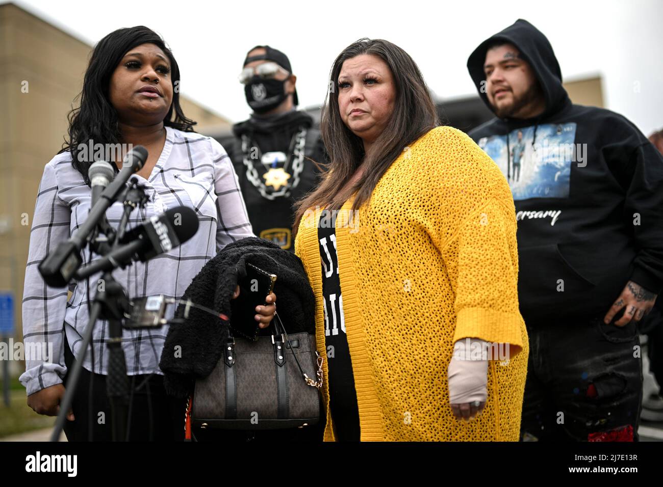 Katie Wright, center, stands beside activist Toshira Garraway and her son, Damik Bryant, during ...