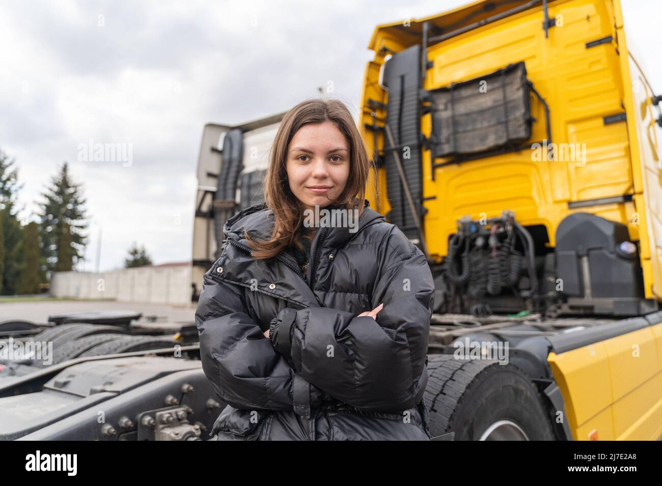 Caucasian young woman driving truck. trucker female worker, transport ...