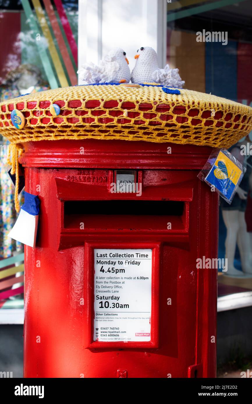 Ukraine tribute on postbox, a post box topper, a knitted hat on top of ...