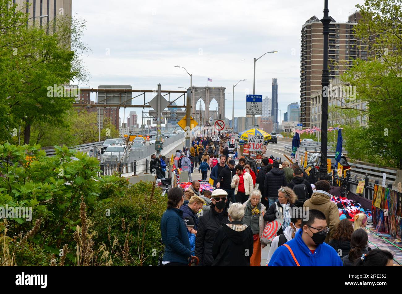 Tourists are coming back to New York City. A big crowd is seen walking ...