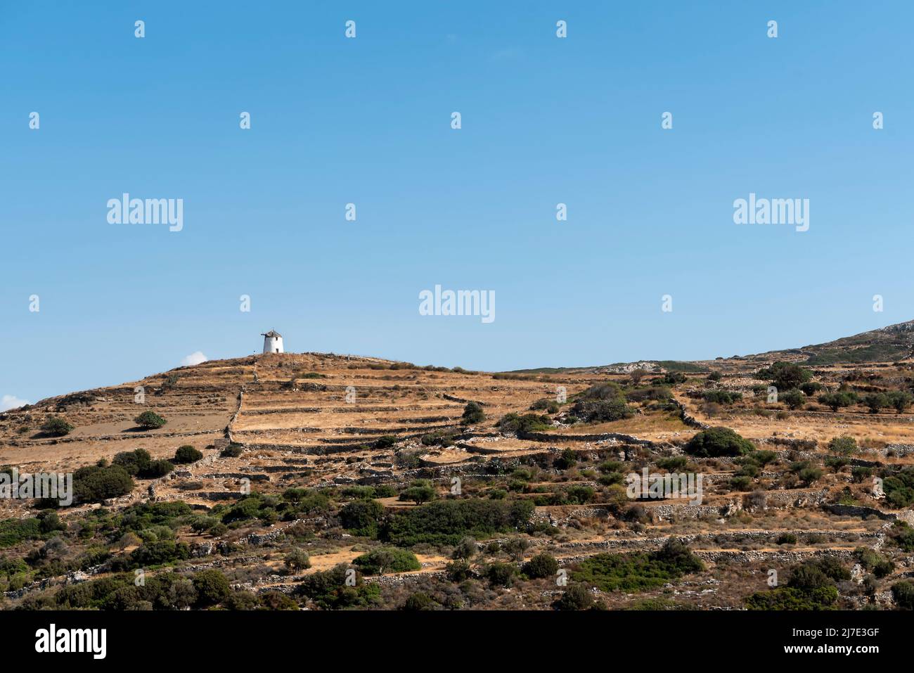 Old windmill by trees on landscape hi-res stock photography and images ...