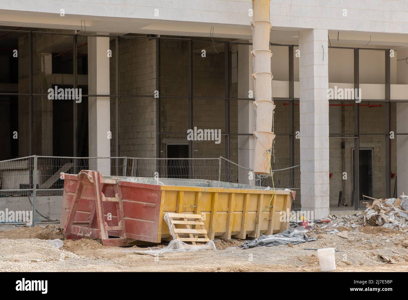 metal tank container Dumpster for construction Waste, rubble near a ...