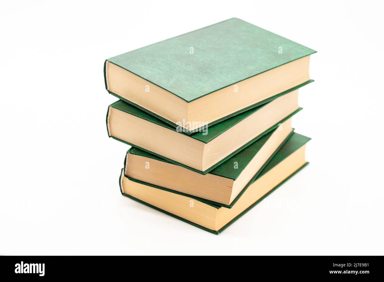 Books stack with green covers on a white background.Reading of books ...