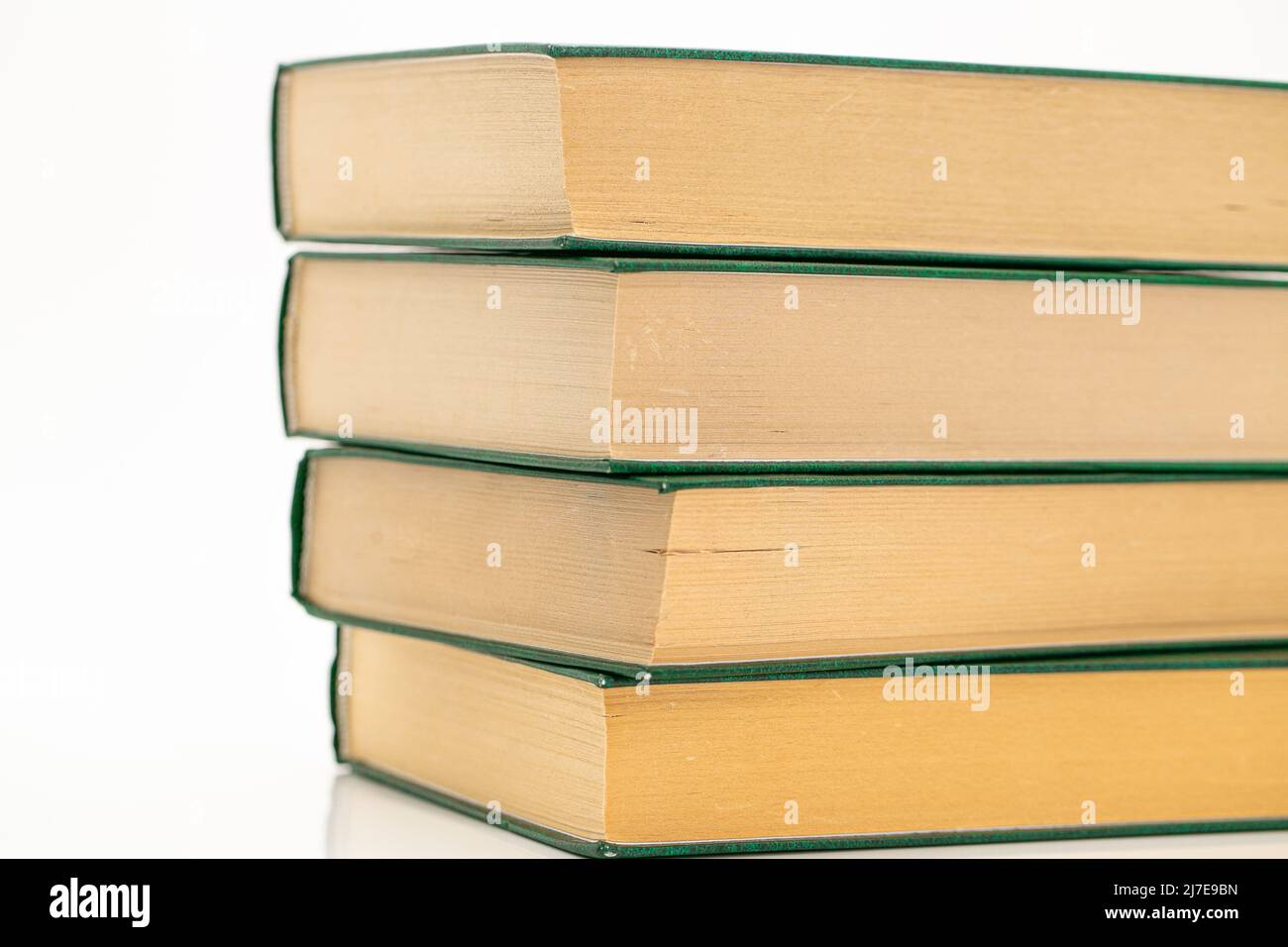 Books stack with green covers on a white background.Reading of books ...